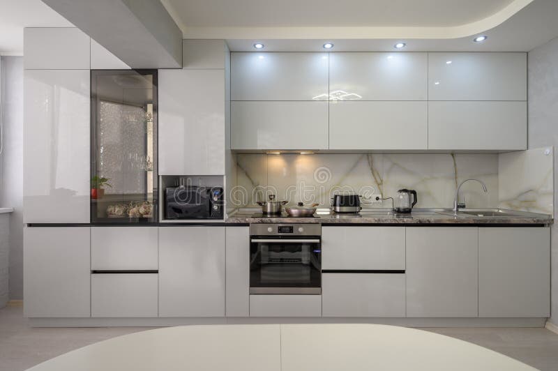 Interior of Modern Trendy White Kitchen, Front View Stock Photo - Image ...