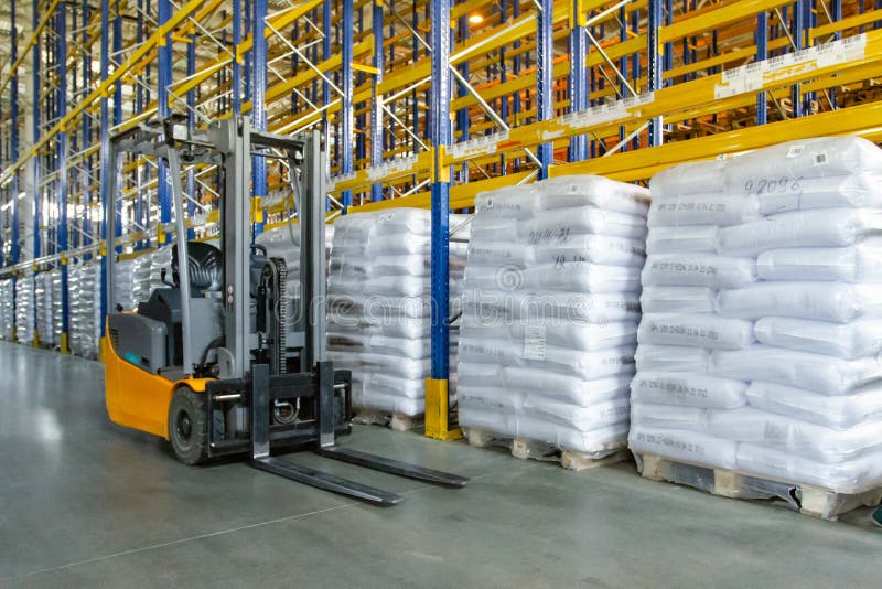 Interior of a Modern Warehouse with Forklifts. Pallet Stacker Truck ...