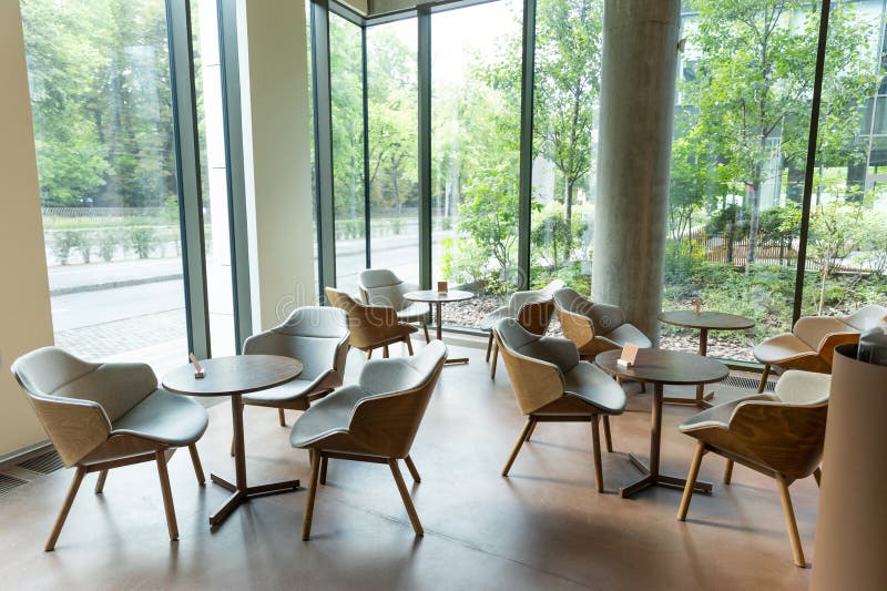 Interior of a Nice Modern Cafe with Cozy Chairs and Round Tables Stock ...