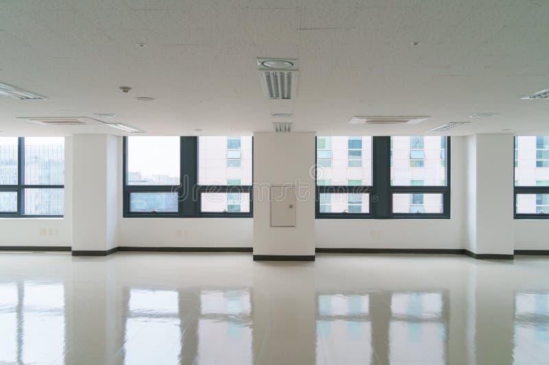 Interior Photo of an Empty Office with Thick Columns and a Wall with a ...