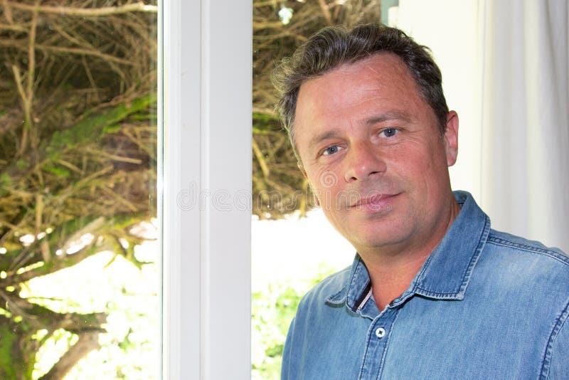 Interior Portrait of Confident Middle Aged Forties Man at Home Windows ...