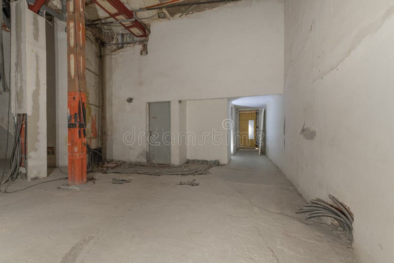 Interior Premises Under Construction with Raw Cement Floors and Half ...