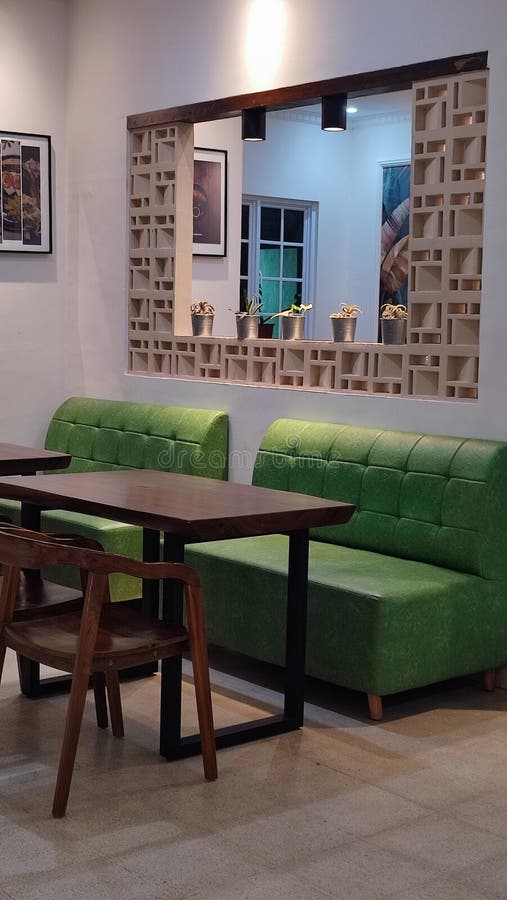 The Interior of a Restaurant Consisting of Sofas, Chairs and Teak ...