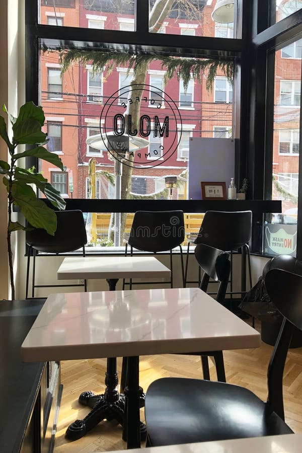 Interior of a Restaurant with Tables, Chairs and a Signboard Editorial ...