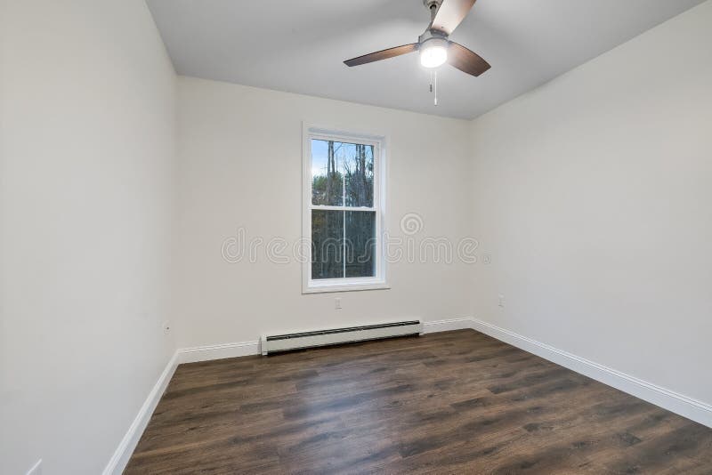 Interior of a Room with a Parquet Floor, White Walls and Windows and a ...