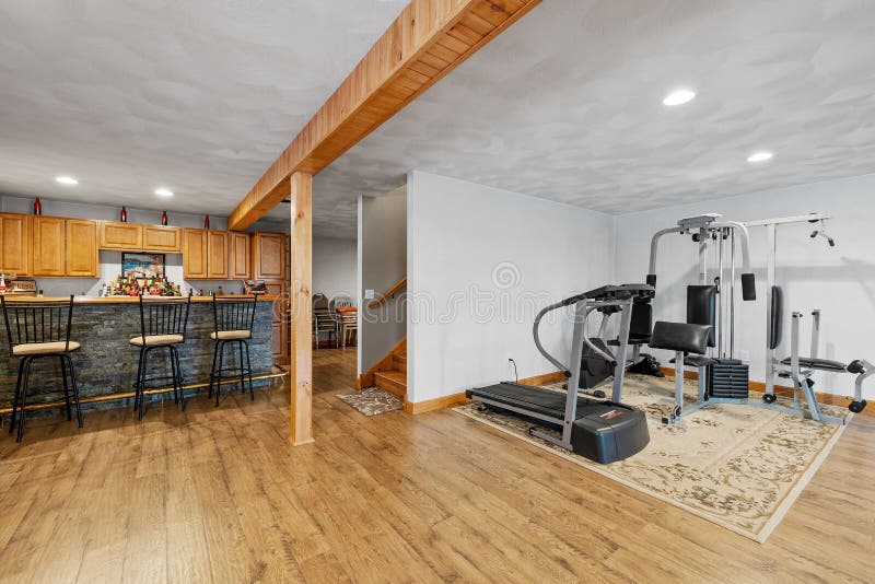 Interior of a Rustic House Design with a Home Gym and an Open Kitchen ...