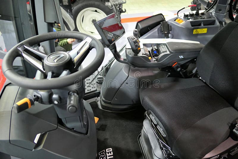 Interior with Seat, Driving Wheel, Controls, Display and Controller in ...