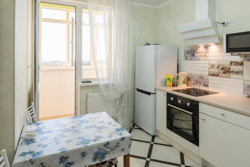 The Interior of a Small Kitchen with a Balcony Stock Photo - Image of ...