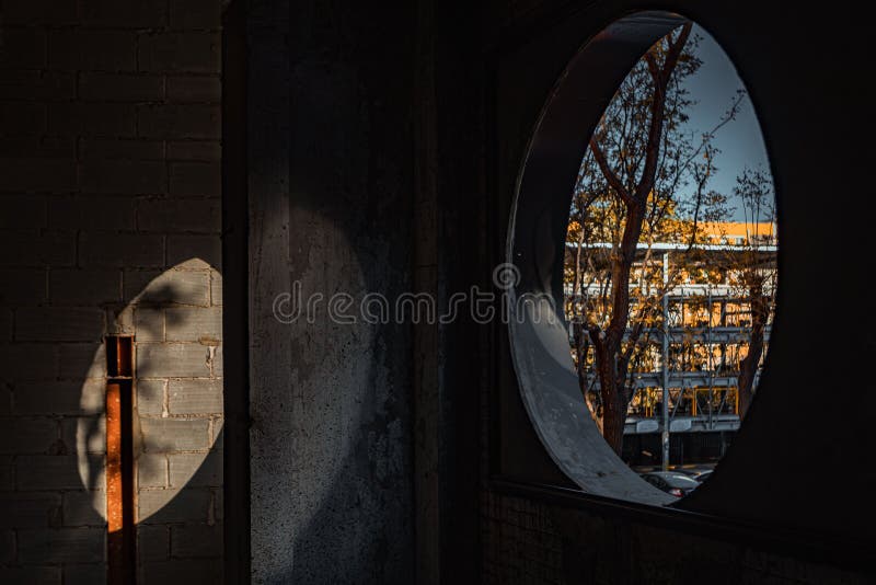 Interior of a Stone Building with a Circular Window Overlooking a Park ...