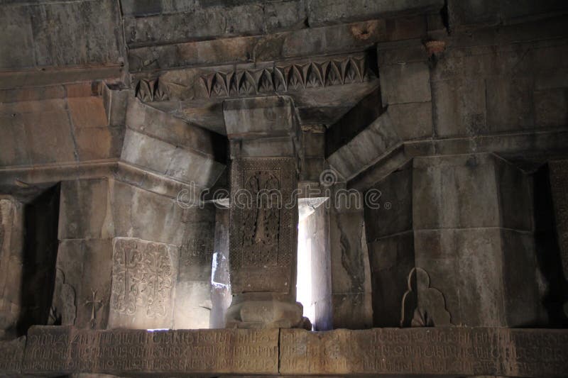 Interior of a Stone Structure with Carvings and Inscriptions ...