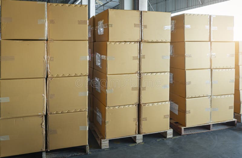 Stacked of Package Boxes on Pallet Rack and Forklift Pallet Jack ...