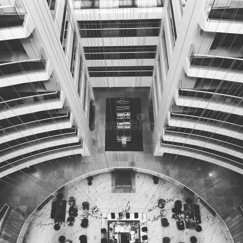 Interior of a Tall Building with a Lounge at First Floor Stock Image ...