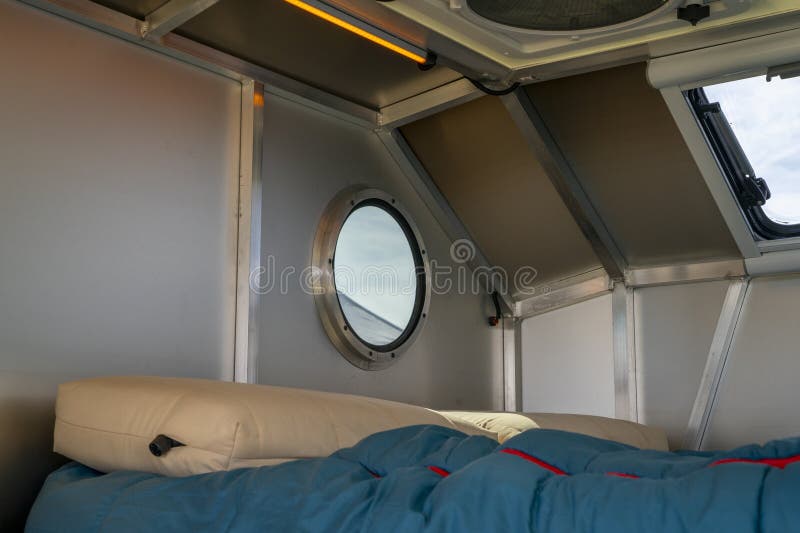 Interior of Truck Camper with a Bed and Windows Stock Photo - Image of ...