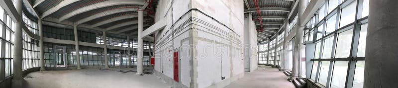 The Interior of an Unfinished Curved Building Reveals a Spacious Hall ...