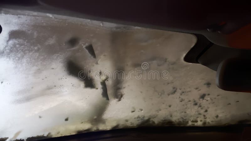 Interior View of a Car Windshield Partially Cleared by Struggling ...