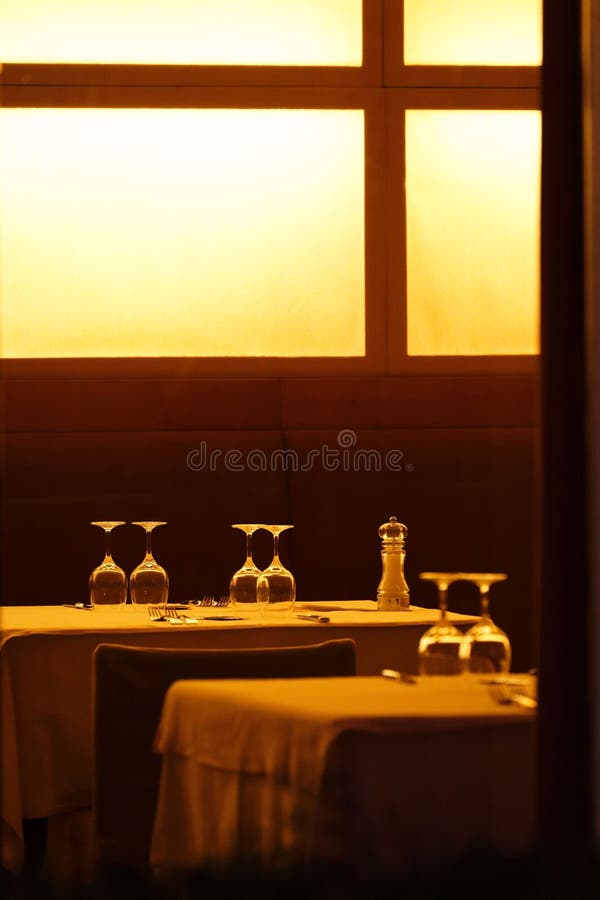 Interior View of a Cozy Restaurant Dining Area, with Warm Sunlight ...