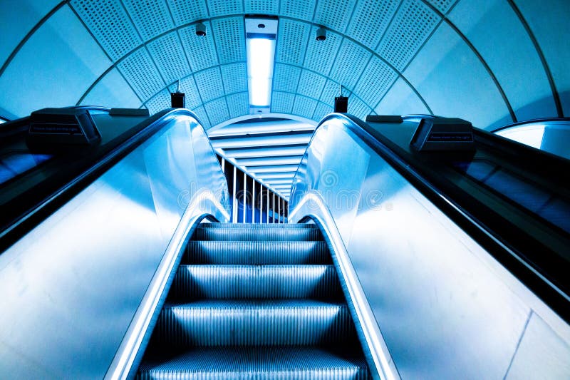 Interior View of an Escalator with Blue Lights in a London Underground ...