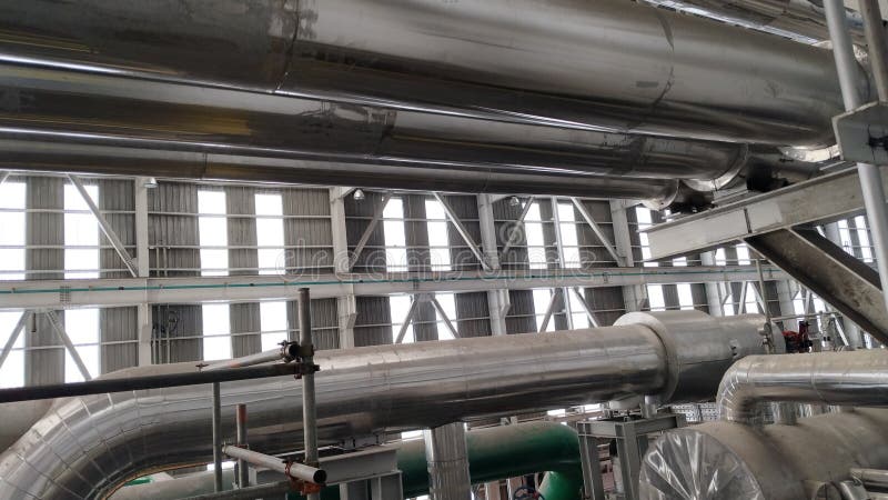 Large Industrial Facility with Metal Pipelines and Structural Support ...