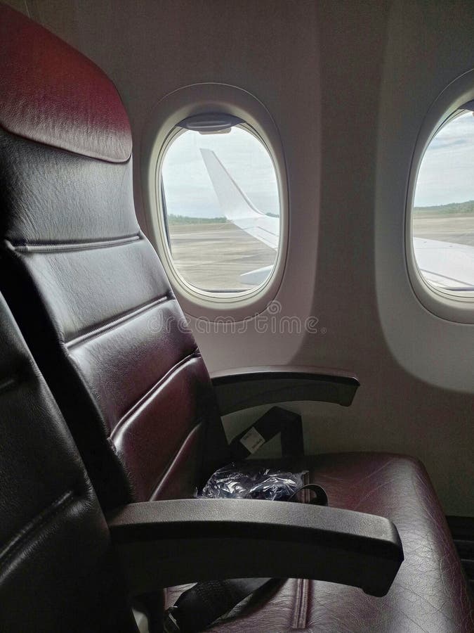 Interior View of a Passenger Jet Airplane with the Wingtip and Wing ...