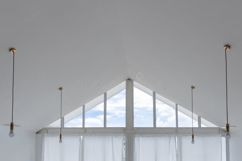 Interior View Of Triangle Shape Window With White Curtain And Cloud Sky ...