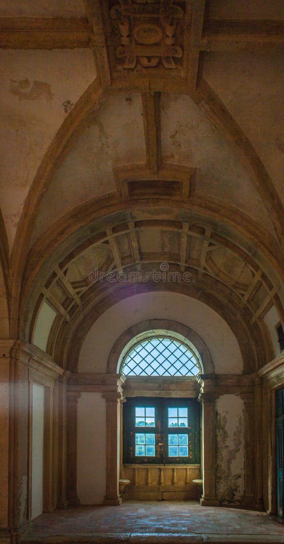 Interior View with a Vaulted Ceiling, a Large Arched Window Casting a ...