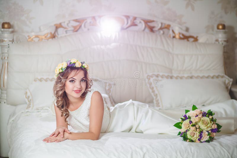 Bride lying on the bed stock photo. Image of happiness - 55269370