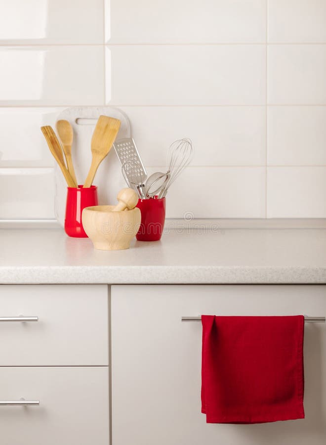Interior White Kitchen with Kitchen Tools and Red Crockery. Stock Photo ...