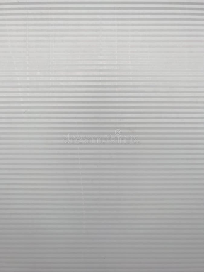 Interior Window with White Shutters Closed, Allowing Light To Filter ...