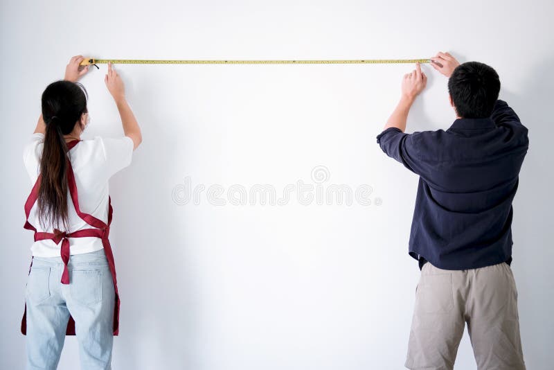 Interior Working, Two Painter with Measure Tape Checking Wall Le Stock ...