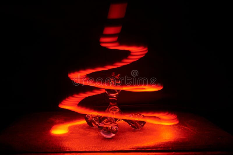 Intermittent Light Spiral Around Glass Toy Stock Image - Image of shine ...