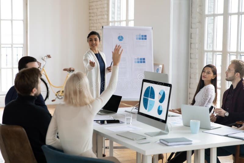 Intern Asking Question To Trainer at Corporate Workshop Stock Photo ...