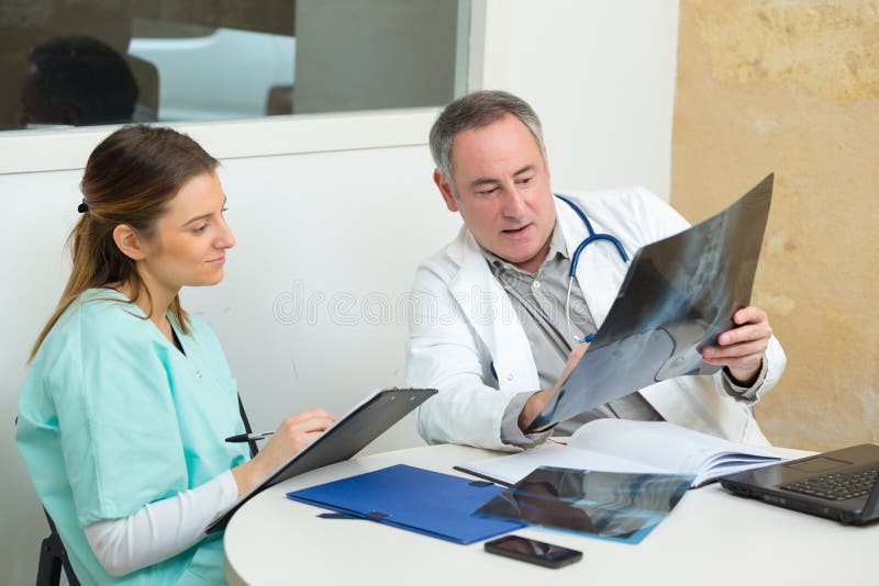 Intern Taking Notes on Xray Result Stock Image - Image of person ...