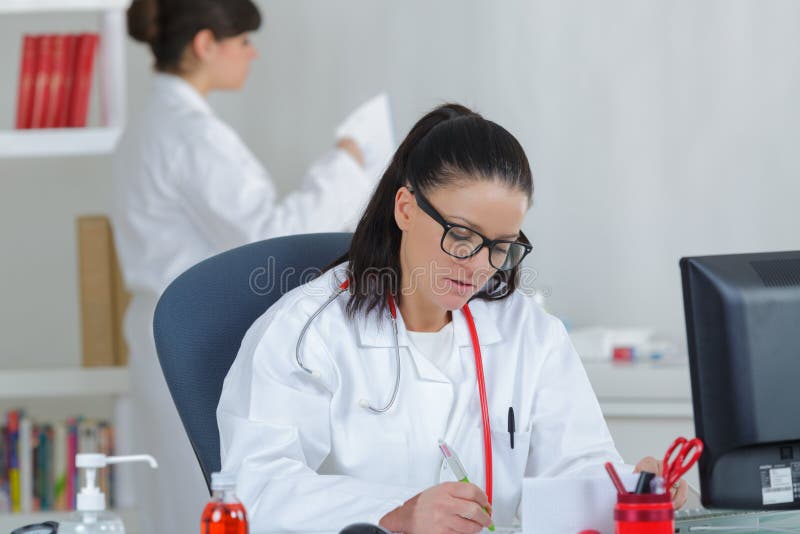 Intern Writes Information To Folder Stock Image - Image of healthcare ...