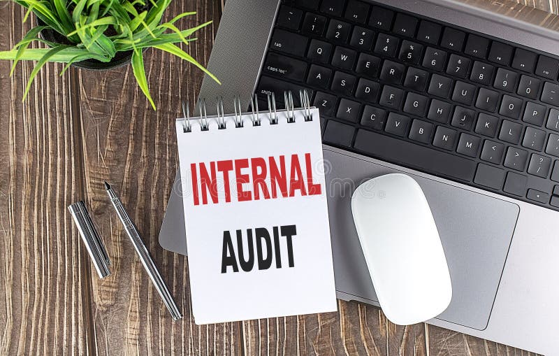 INTERNAL AUDIT Text on Notebook with Laptop, Mouse and Pen Stock Photo ...