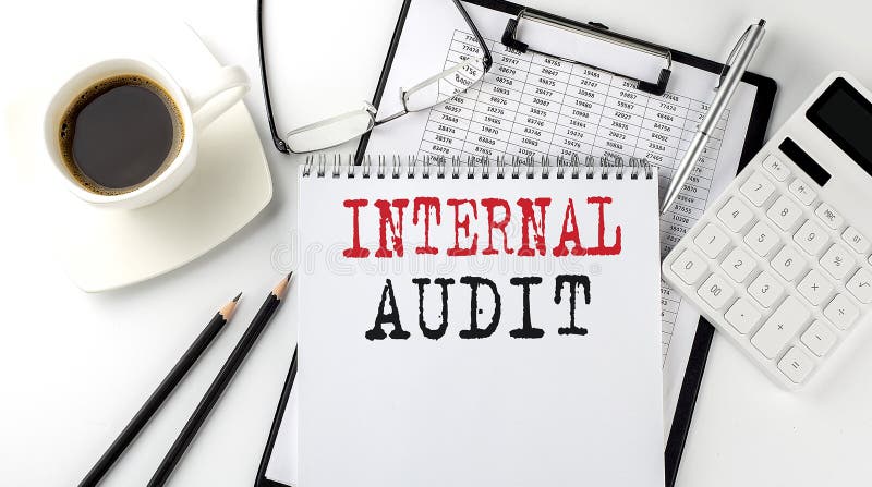 INTERNAL AUDIT Text on the Paper with Calculator, Notepad, Coffee ,pen ...