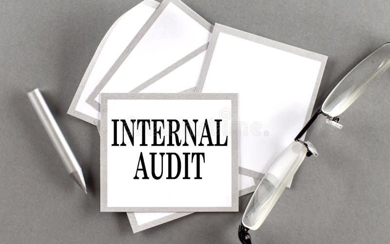 INTERNAL AUDIT Text Written on a Sticky with Pencil and Glasses Stock ...