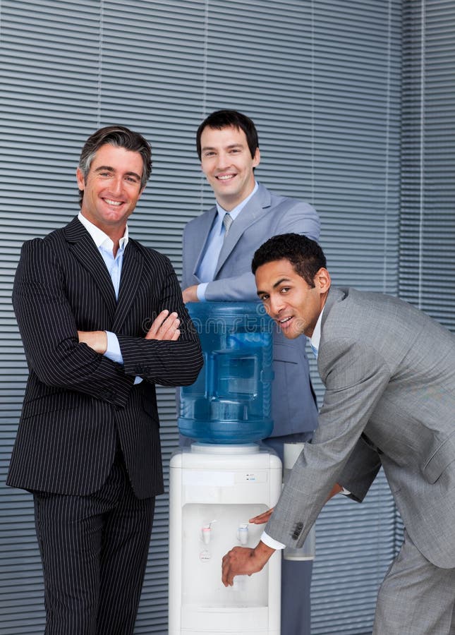 Business People Next To a Water Cooler Stock Photo - Image of indoors ...