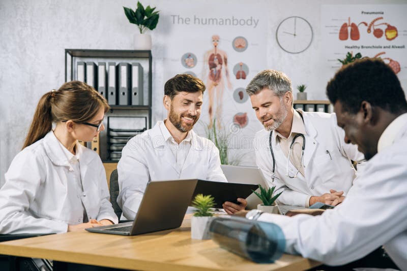 International Group of Doctors Having Discussion at Office Stock Photo ...