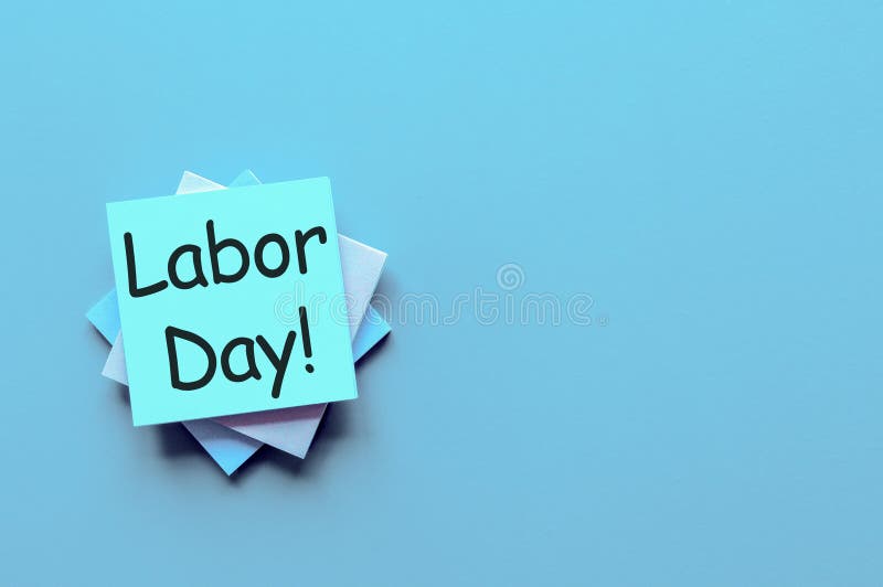 International Labor Day at May 1st. Day Text on Pile of Notes with ...