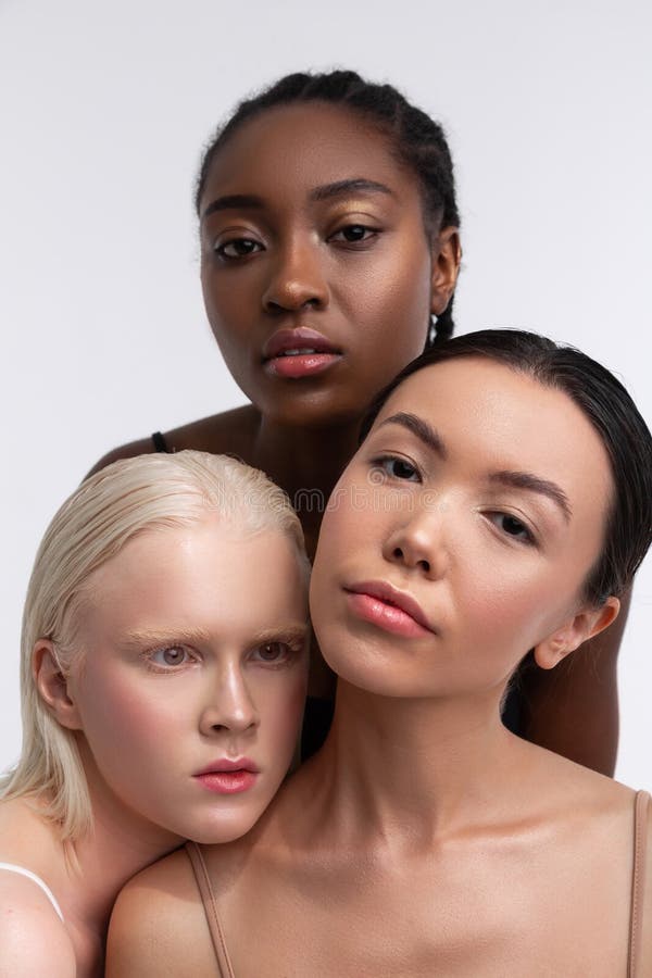 Three Models Working for International Magazine Posing Together Stock ...
