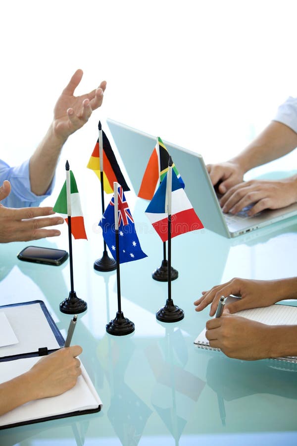 International Meeting with Flags on Table Stock Image - Image of collar ...