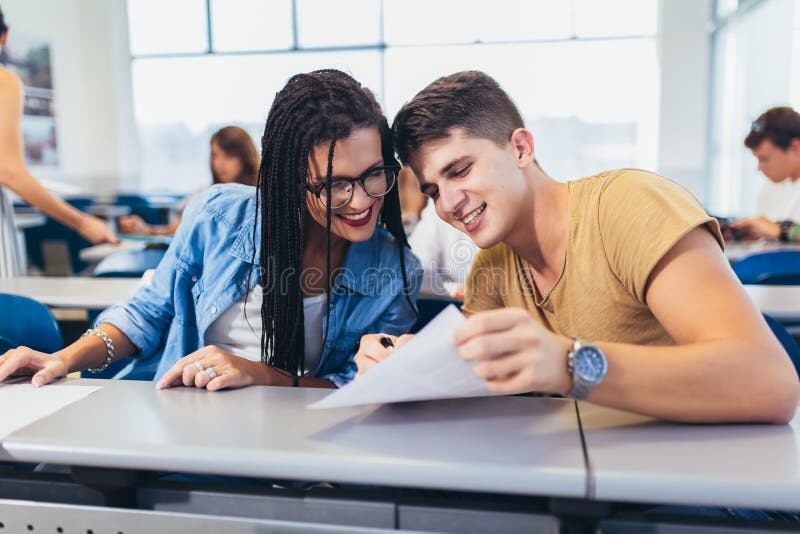 International Students Writing in Lecture Hall and Talking Stock Photo ...