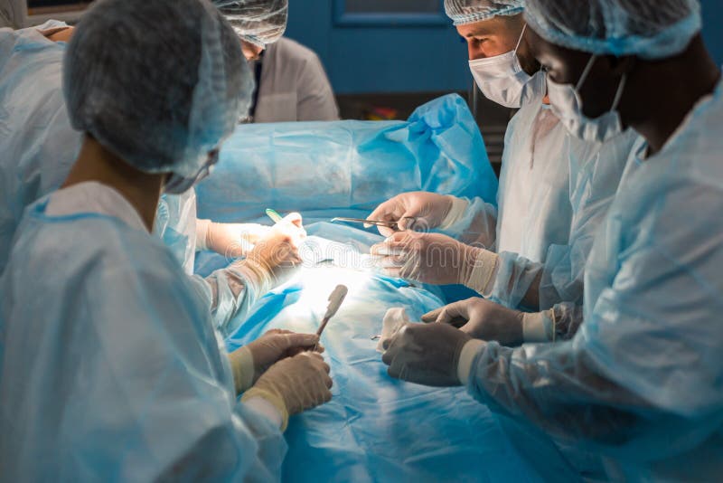 An International Team of Doctors Performs a Complex Surgical Operation ...