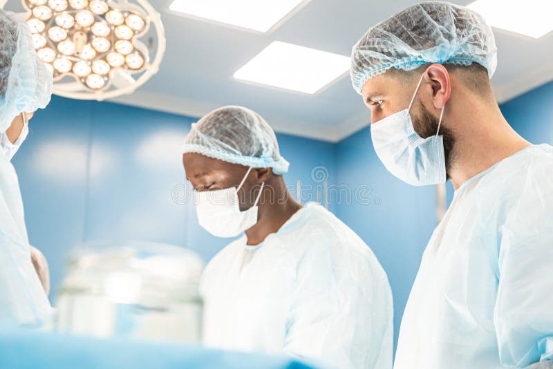 An International Team of Doctors Performs a Complex Surgical Operation ...