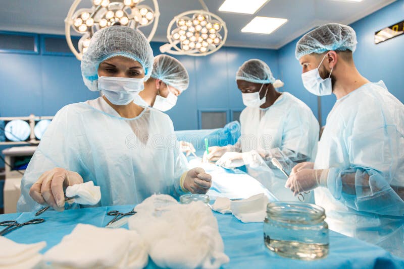 An International Team of Doctors Performs a Complex Surgical Operation ...