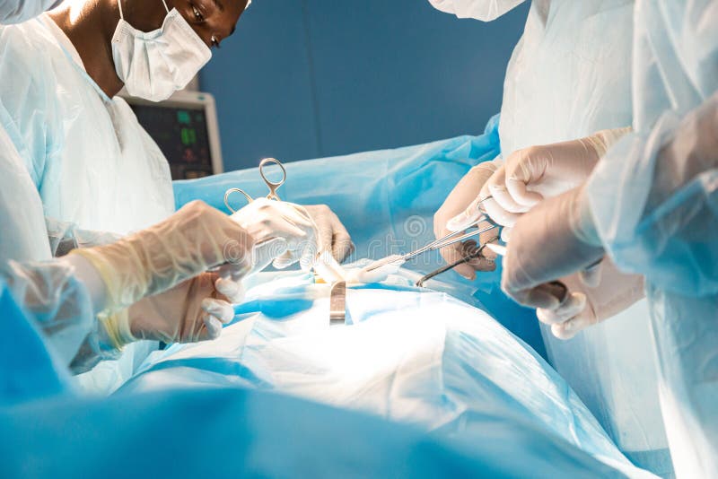 An International Team of Doctors Performs a Complex Surgical Operation ...