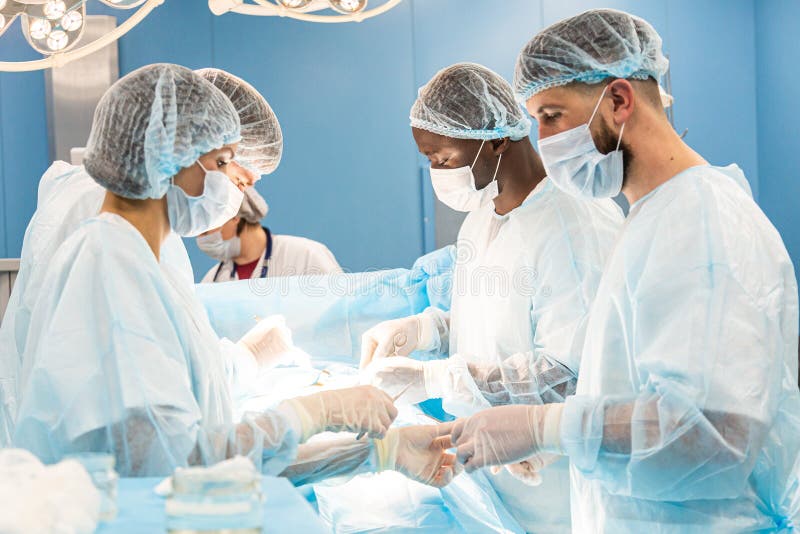 An International Team of Doctors Performs a Complex Surgical Operation ...