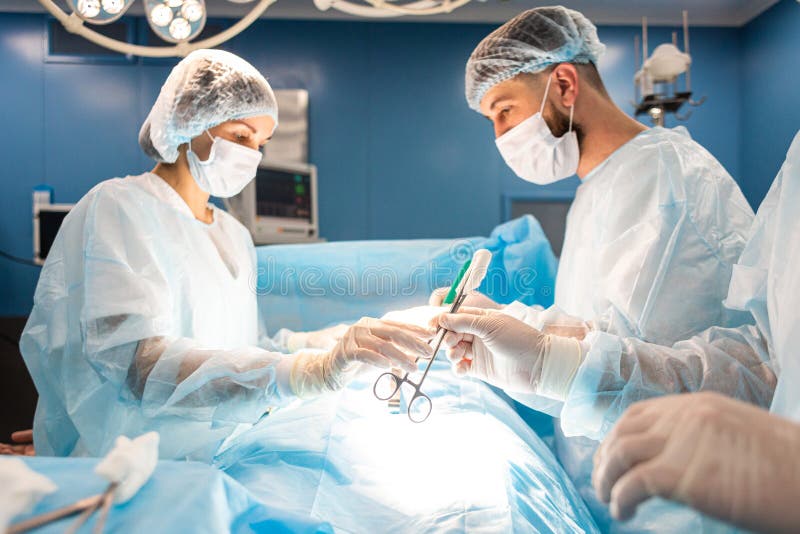 An International Team of Doctors Performs a Complex Surgical Operation ...