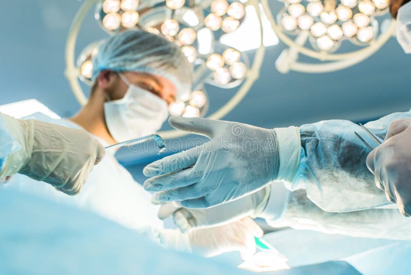 An International Team of Doctors Performs a Complex Surgical Operation ...