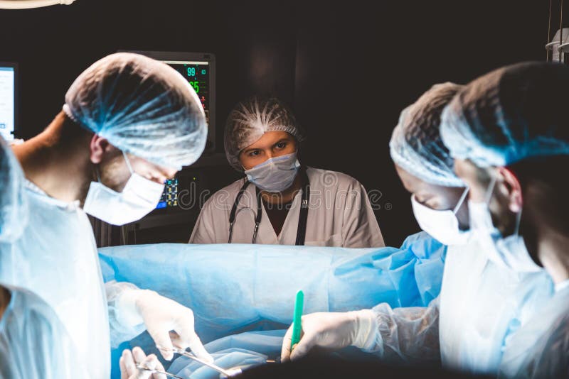An International Team of Doctors Performs a Complex Surgical Operation ...